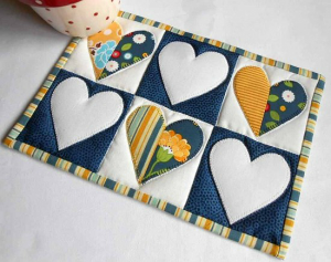 A Charming Hearts Mug Rug for Your Table or Desk - Quilting Digest
